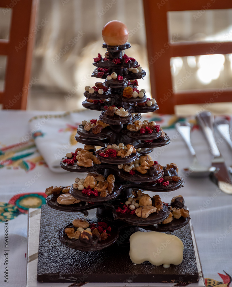 decorative dark chocolate Christmas tree with nuts and white chocolate ...