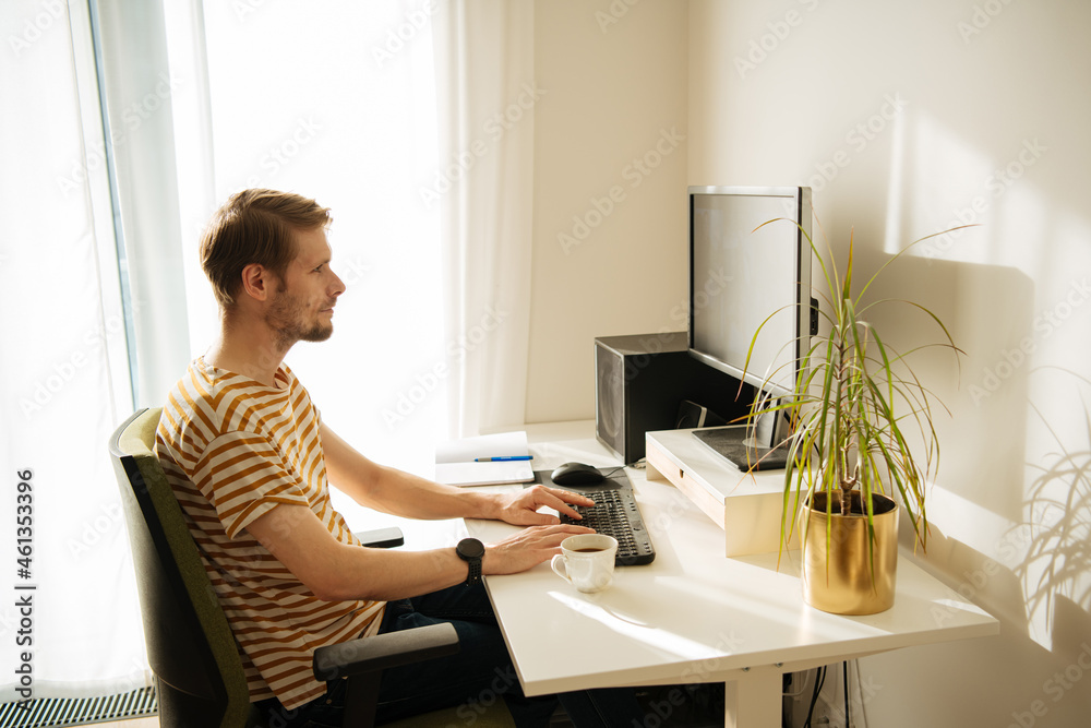 Work from home. Young man having video call via a computer in the ...