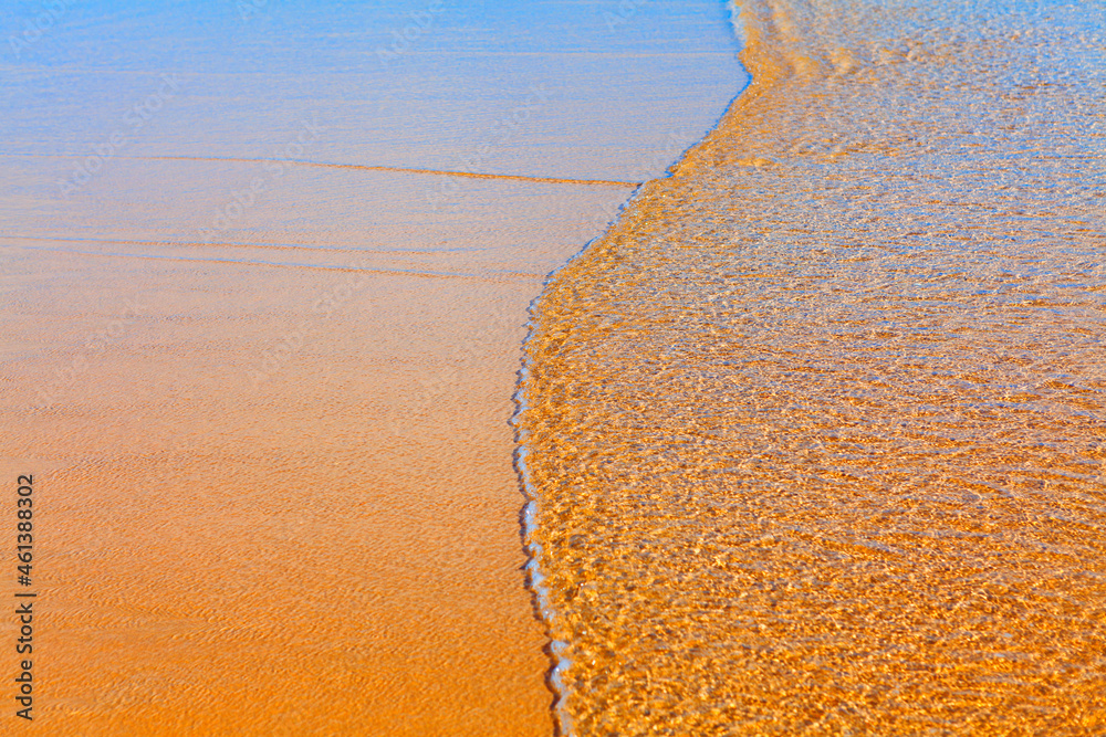 Ocean waves edge on the sand . Transparent water on the sandy beach ...