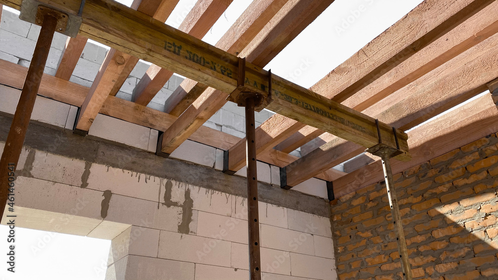 stage of roof overlap with a rafter system, new building, fragment of a ...