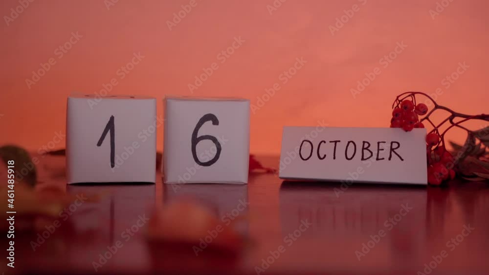 Cube calendar with an important date of October 16th with maple leaves ...