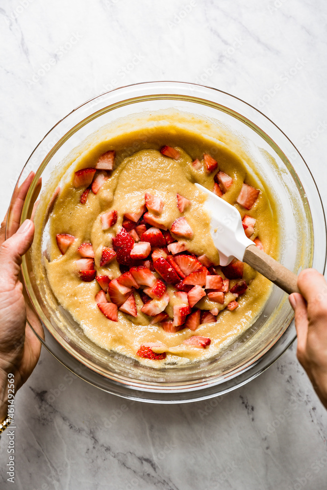 Preparing the ingredients and mixture for a strawberry cake, made with ...