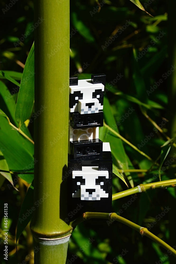 Small black and white LEGO Minecraft Panda sitting on larger one, both ...