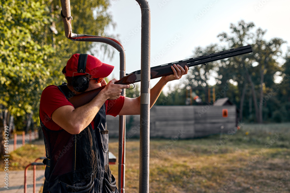 Side View on Young Caucasian Man wear Ear Plug Confidently Aiming ...
