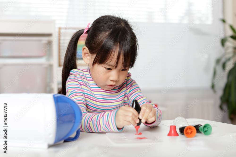 young girl making 3D shape craft for homeschooling Stock Photo | Adobe ...