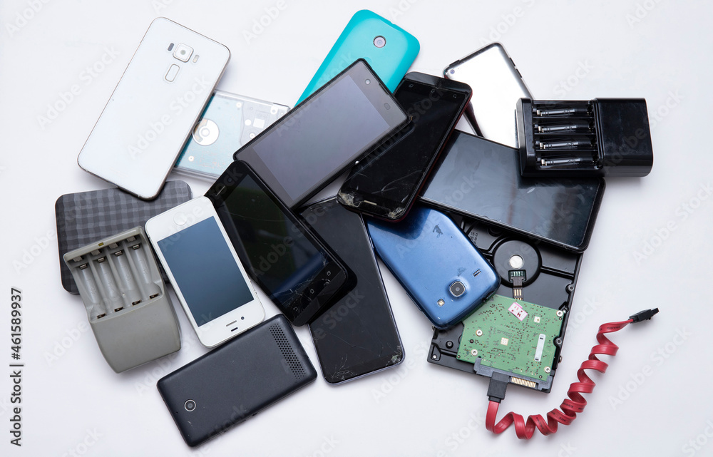 Electronic waste. Used and discarded cell phones and mobile devices ...