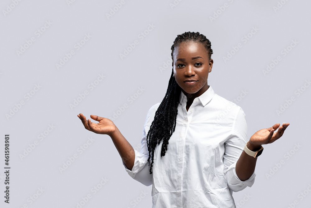 surprised woman raising hands emotionless standing over grey white ...