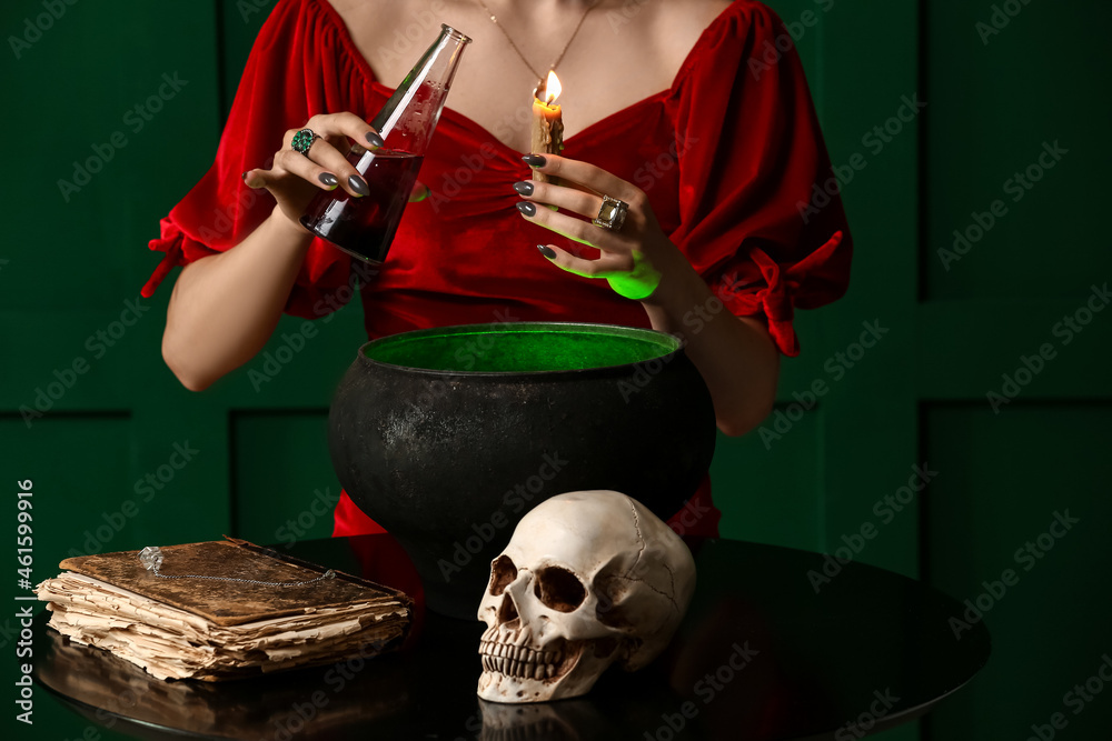 Witch performing ritual on dark color background Stock Photo | Adobe Stock