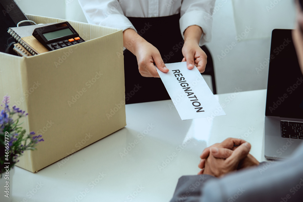female office worker sending resignation letter to boss. There are ...