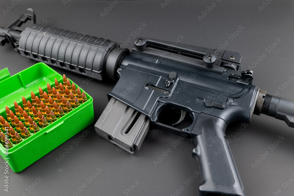 AR-15 style assault rifle with a box of 5.56mm ammunition Stock Photo ...