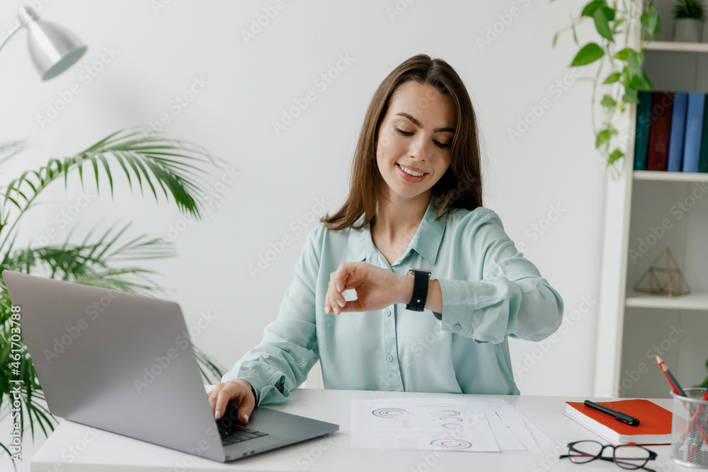 Young satisfied confident successful employee business woman in blue ...