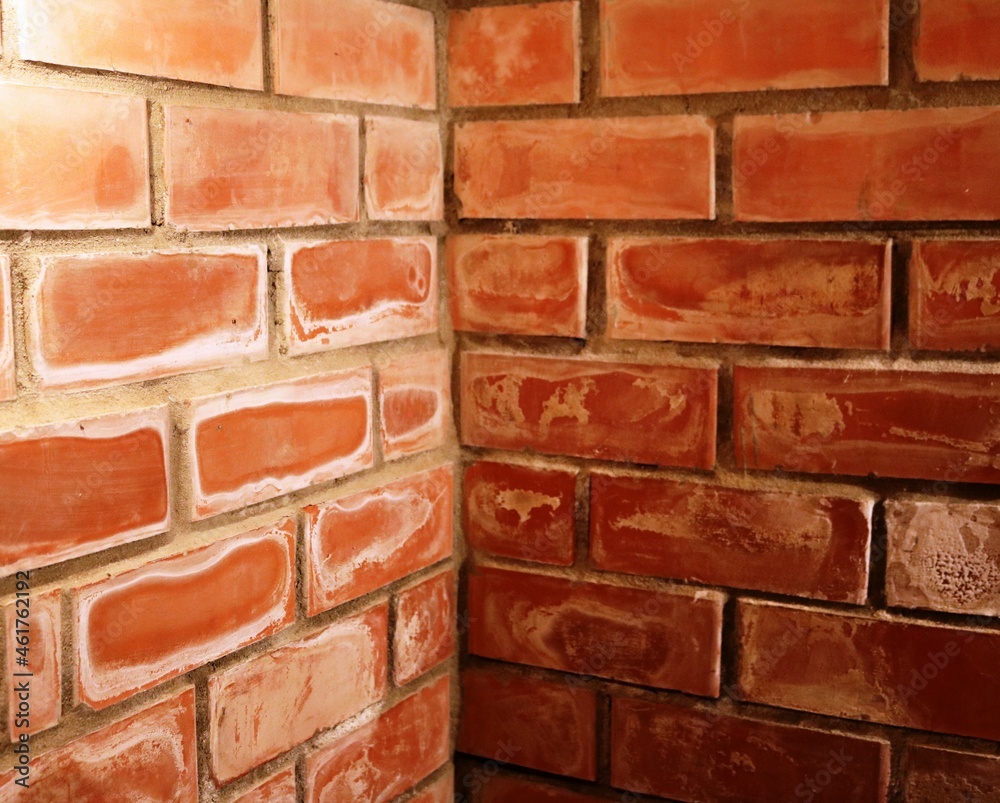 brick corner in the basement as an empty background, the connection of ...