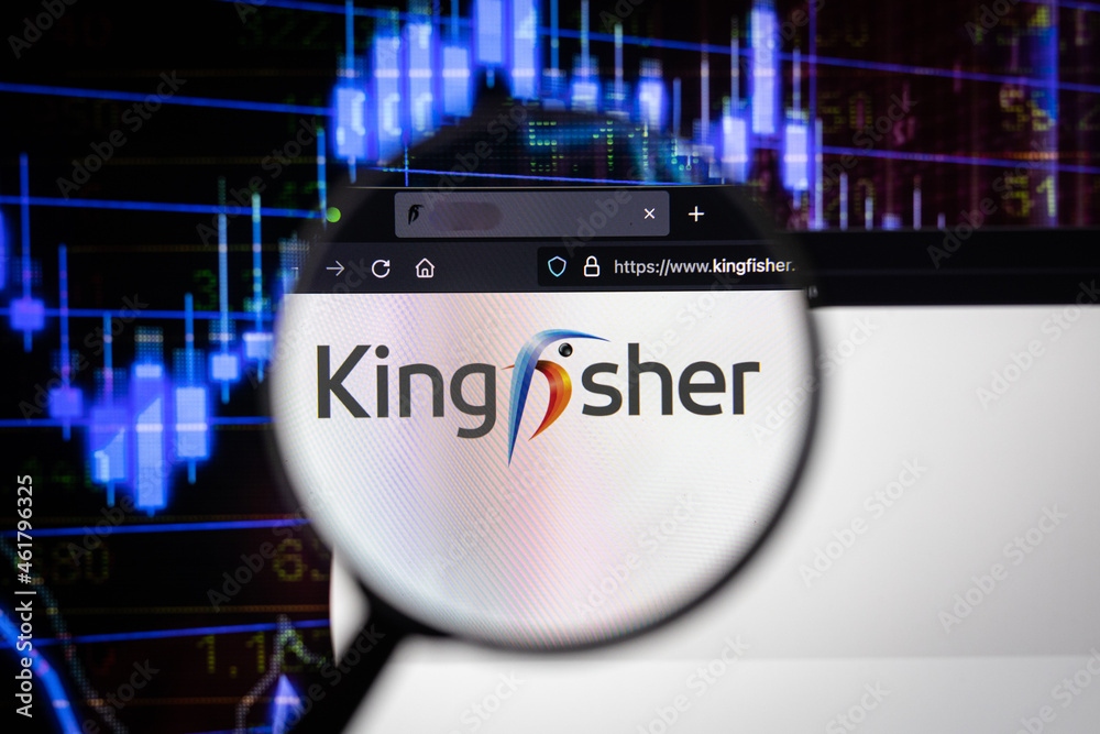 Kingfisher company logo on a website with blurry stock market graphs in ...