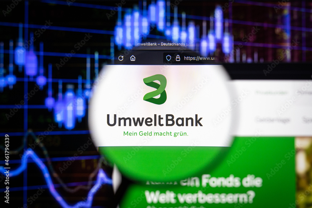 Umwelt Bank company logo on a website with blurry stock market graphs ...