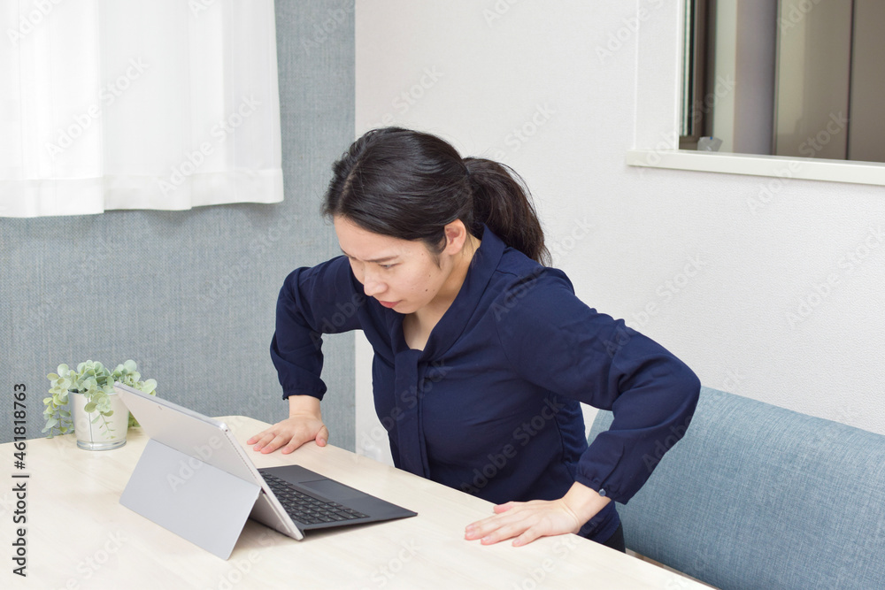 A young Asian woman gets angry at her colleague and shows her emotion ...