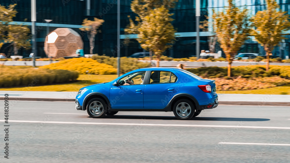 Dacia Logan Stepway car moving in the street. Renault Logan Stepway car ...