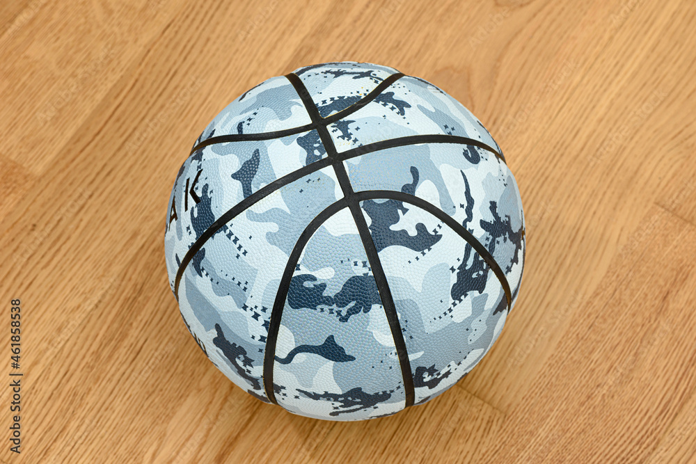 Camouflage basketball ball on wooden court background. Stock Photo ...