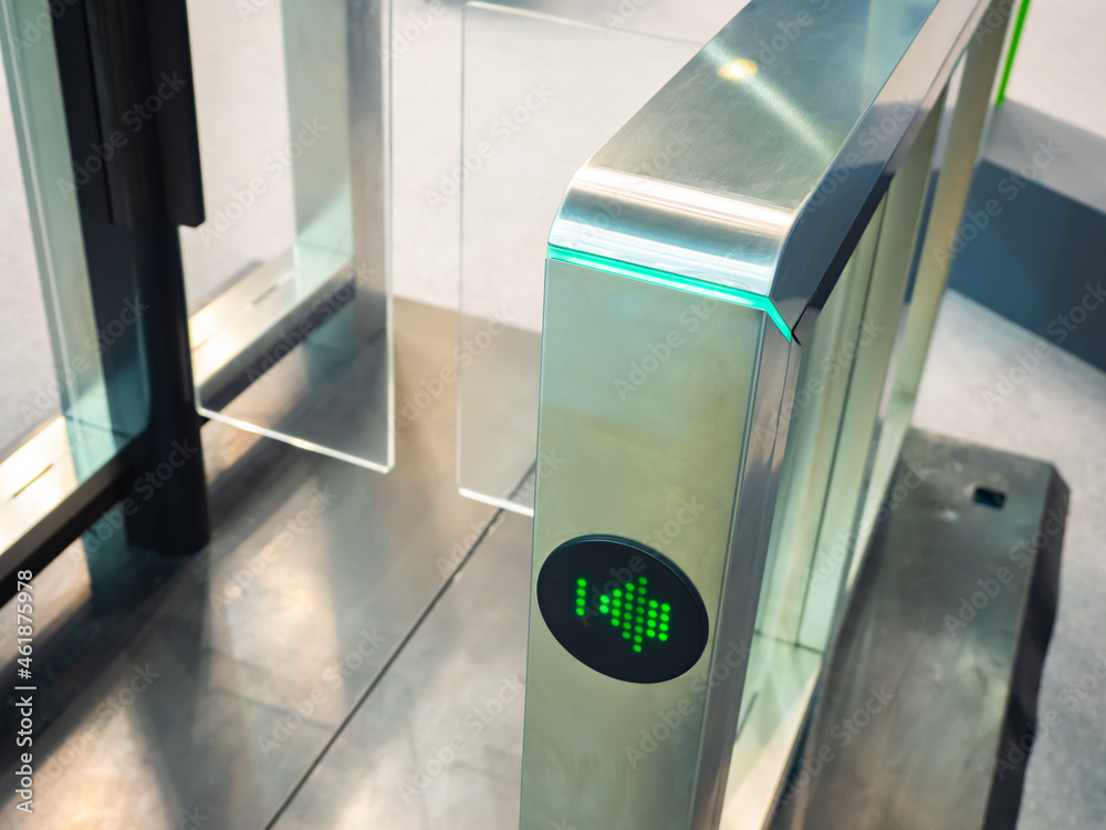 Turnstile for entering building. Green arrow on turnstile screen ...