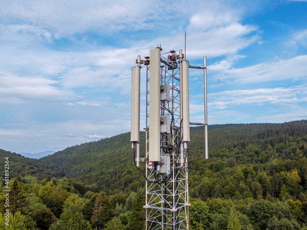 Foto de Aerial drone view of GSM and radio telecommunication tower in mountains. Cell phone ...