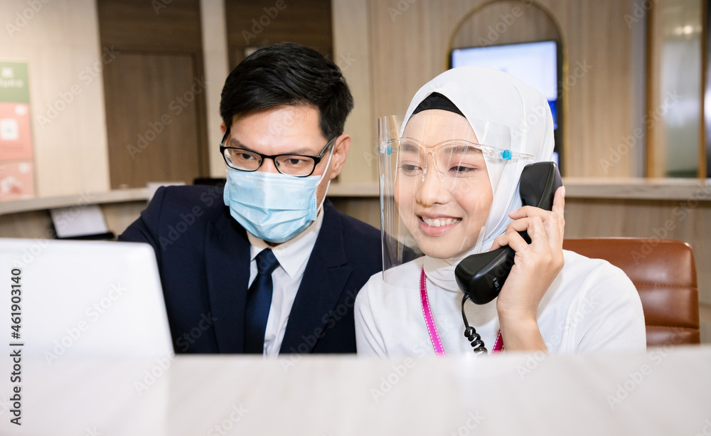 A beautiful Muslim call center is chatting with a customer over the ...