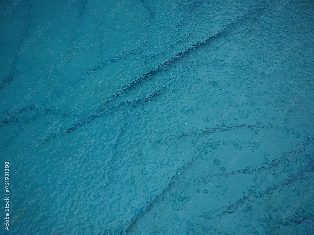 Rubber round pool filled with water. Blue water in the pool. Large ...