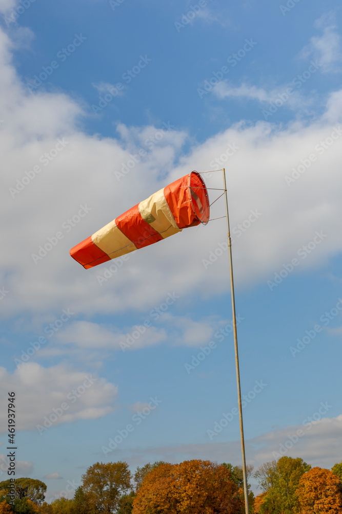 Windsock indicator of wind on runway airport. Wind cone indicating wind ...