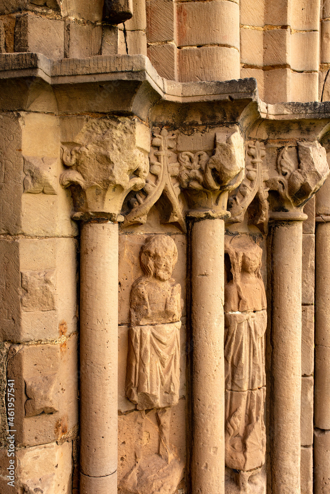 Stone columns and figures carved on a medieval abbey ruin. Medieval ...