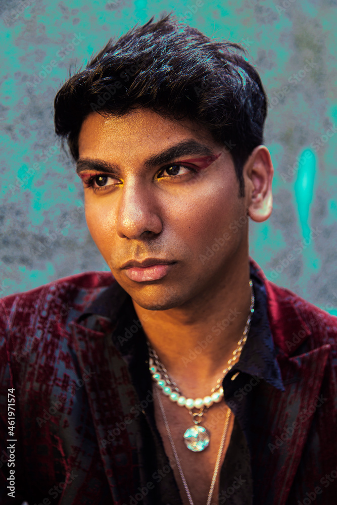 fashion portrait of dark skinned Indian man in concrete surroundings ...