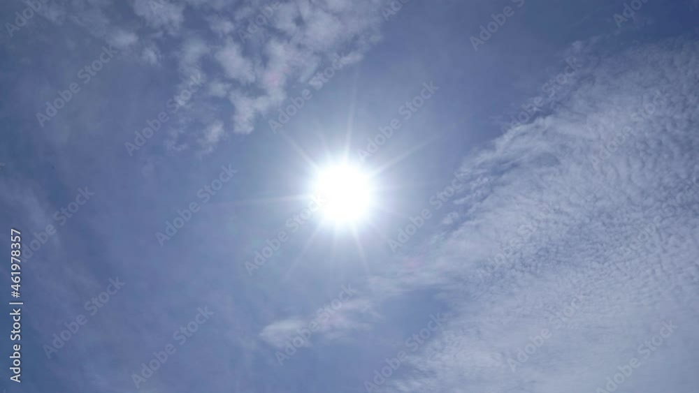 Nature view of direct bright noon sun on blue sky with clouds Sun ...