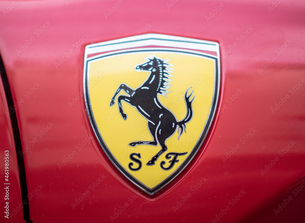 Ferrari logo, yellow shield with Italian tricolor and black prancing ...