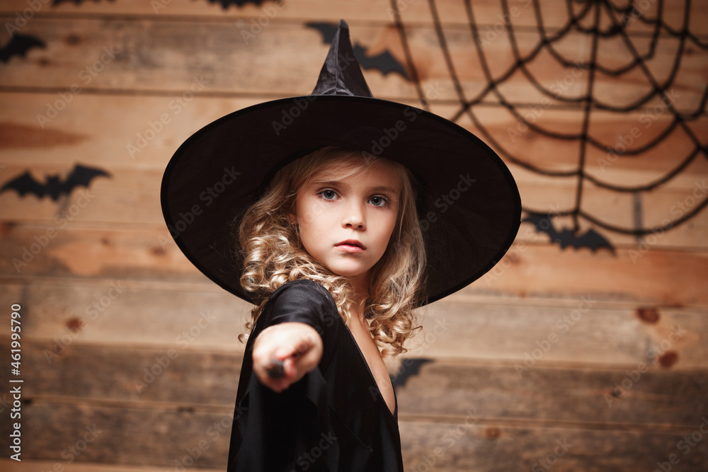 Halloween Witch concept - little witch child enjoy playing with magic ...