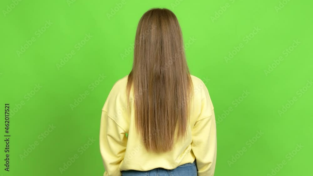 Teenager girl pointing back with the index finger over isolated ...