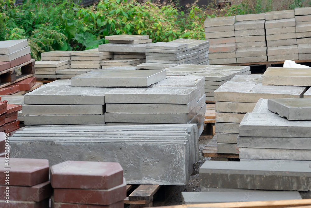 Samples paving slabs of various shapes and colors at construction site ...