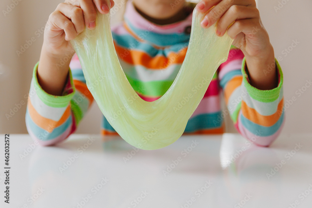the child stretches the mucus to the sides. Children's hands are ...