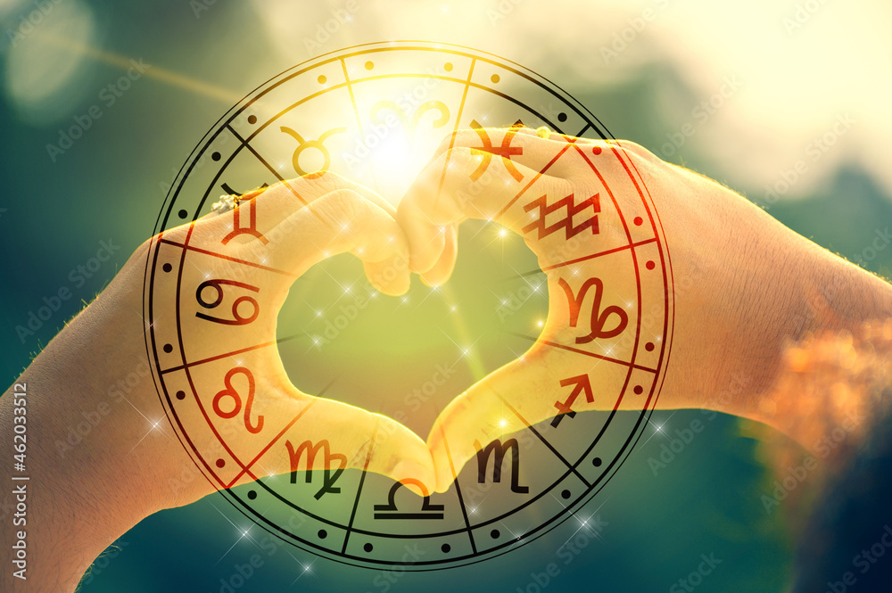 The hands of women and men are the heart shape with the sun light ...