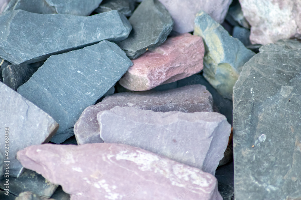 Raw rocks and minerals as natural stones background with crushed and ...