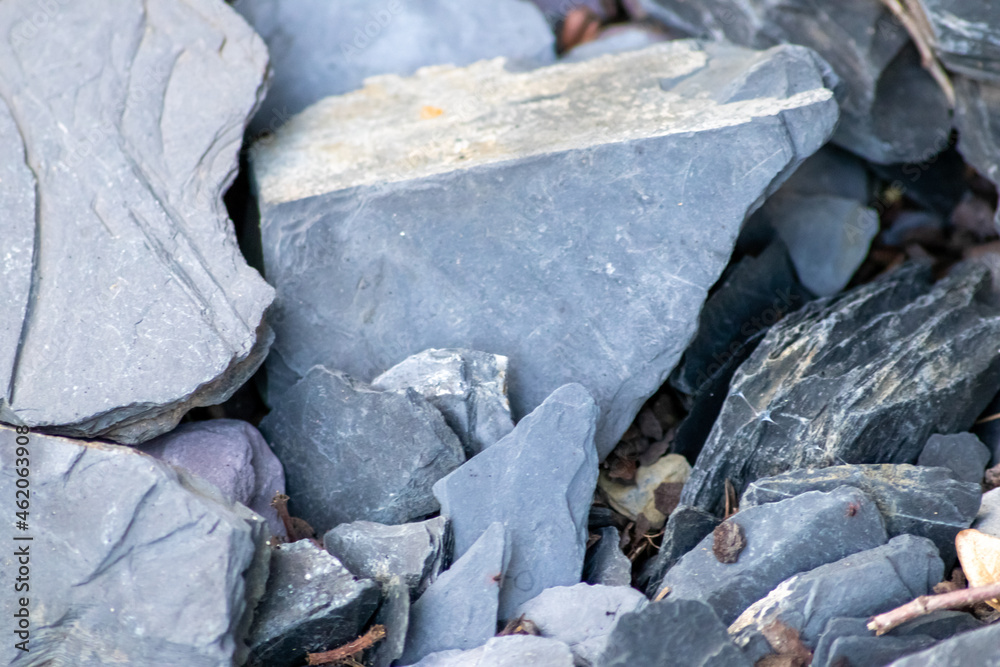 Raw rocks and minerals as natural stones background with crushed and ...