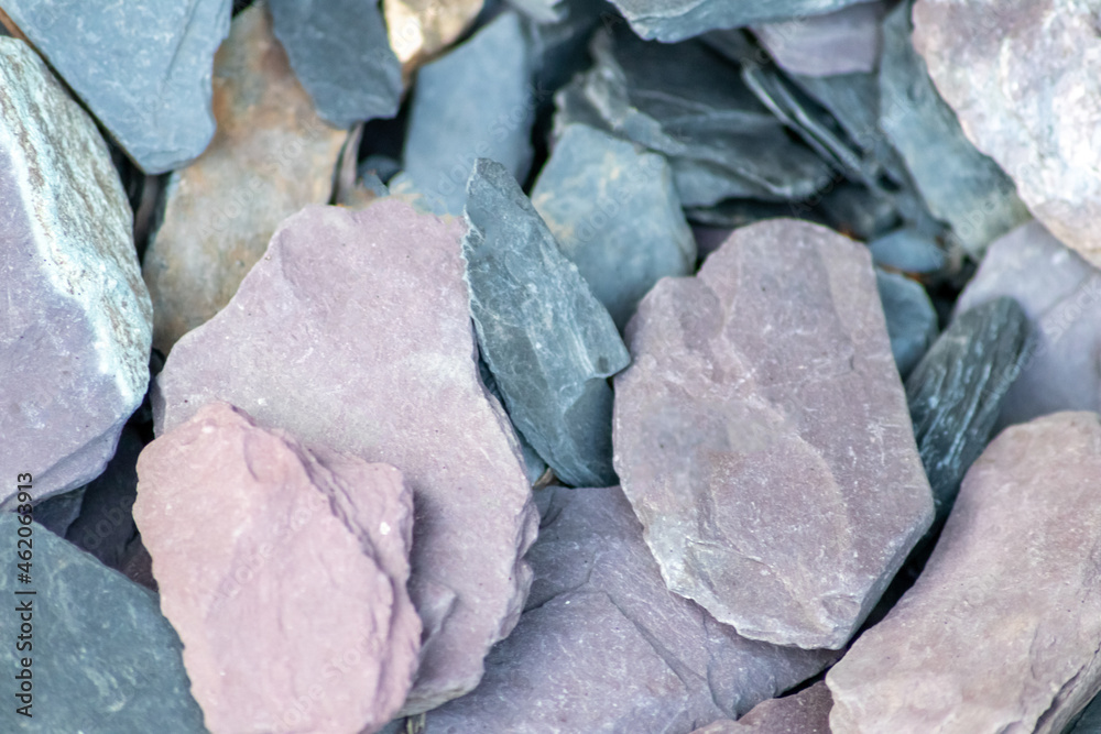 Raw rocks and minerals as natural stones background with crushed and ...