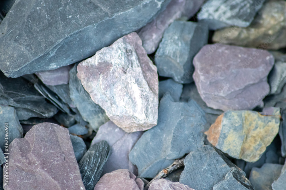Raw rocks and minerals as natural stones background with crushed and ...