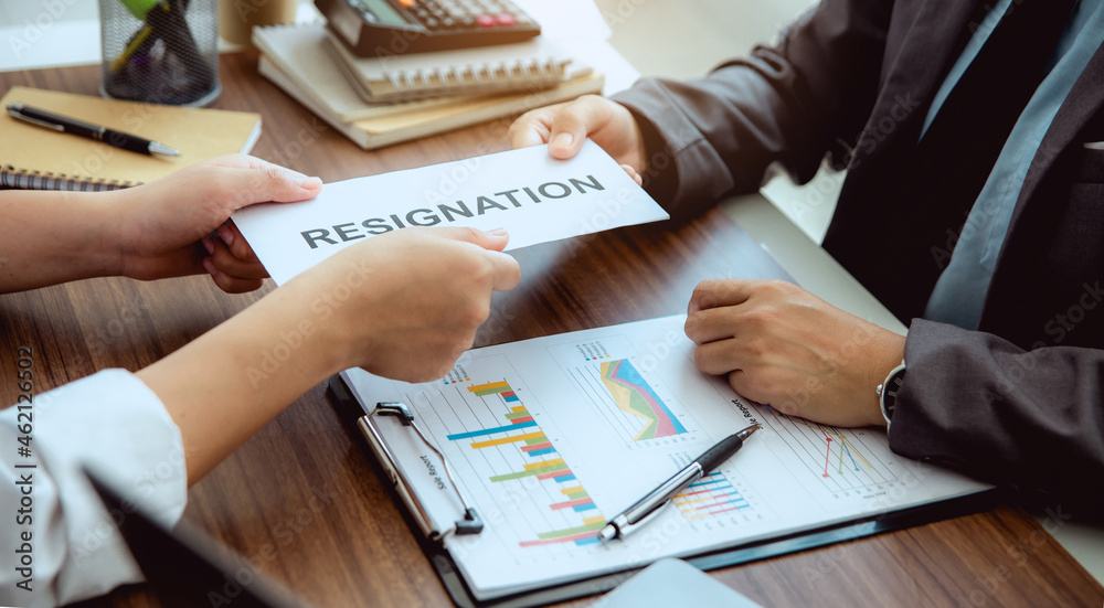 At the office, the boss receives a letter of resignation from a female ...