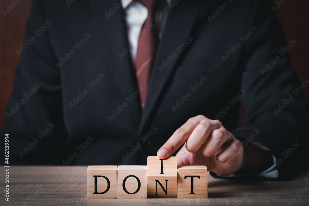 businessman Hand choose wooden cube block with word don t change to do ...