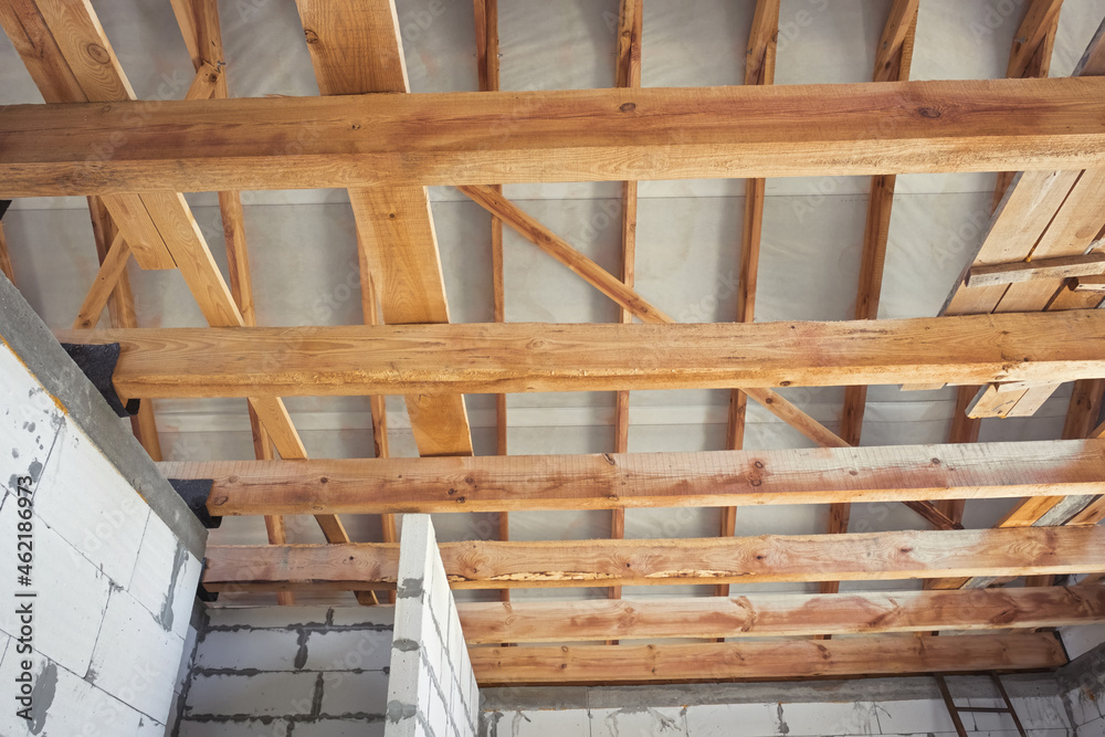 Timber frame of the roof of the new house. Roofing structures. Wooden ...