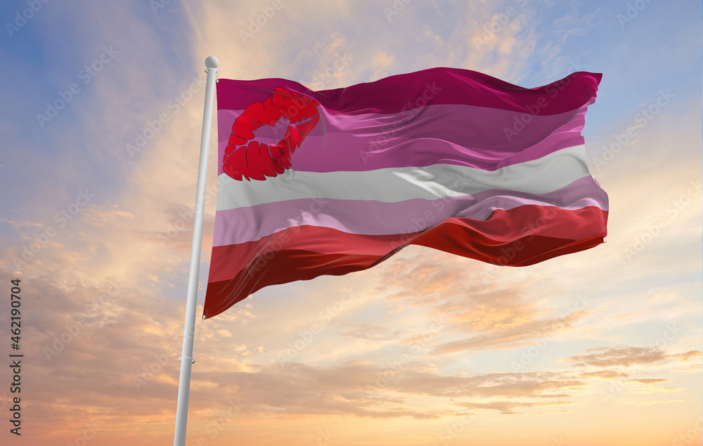 Lipstick lesbian Pride flag waving in the wind at cloudy sky. Freedom ...