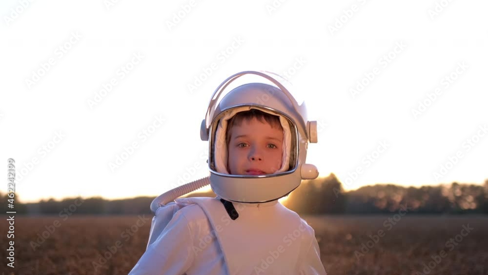 Portrait of little young child boy wearing astronaut uniform, helmet ... Portrait of little young child boy wearing astronaut uniform, helmet ...