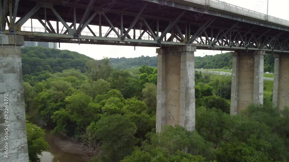 The Don Valley Parkway in Toronto appears between the piers of a bridge ...