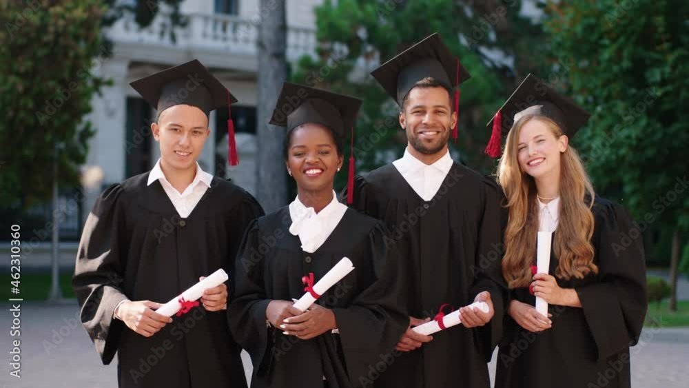 In the college garden in front of the camera posing group of ...