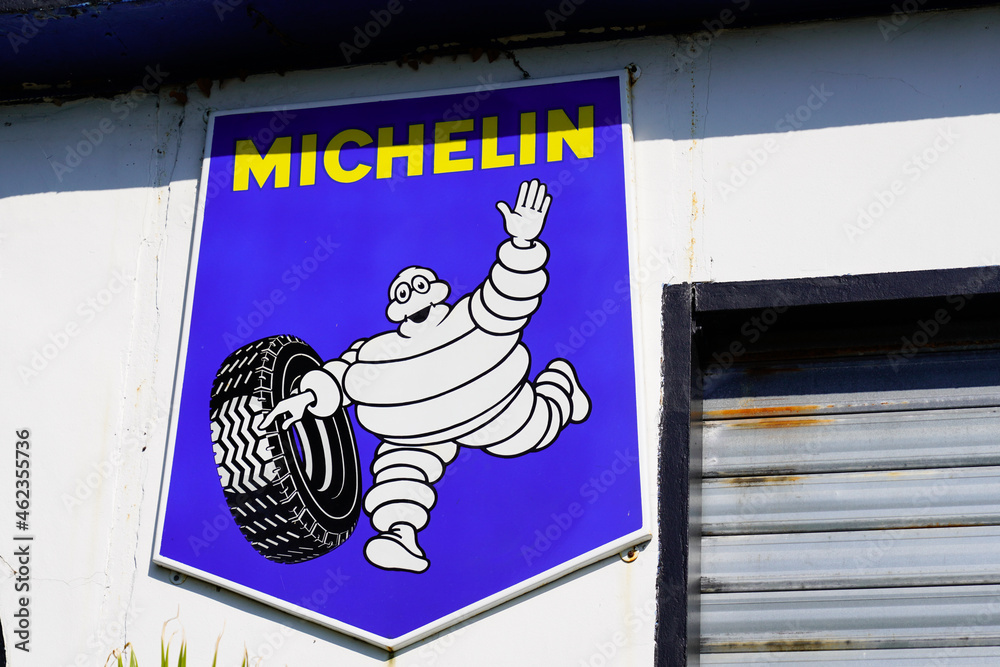 michelin brand logo and text sign front of french tyre station garage ...