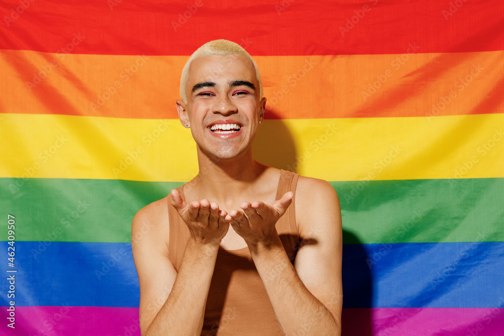 Young queer surprised excited smiling cool happy blond latin gay man ...