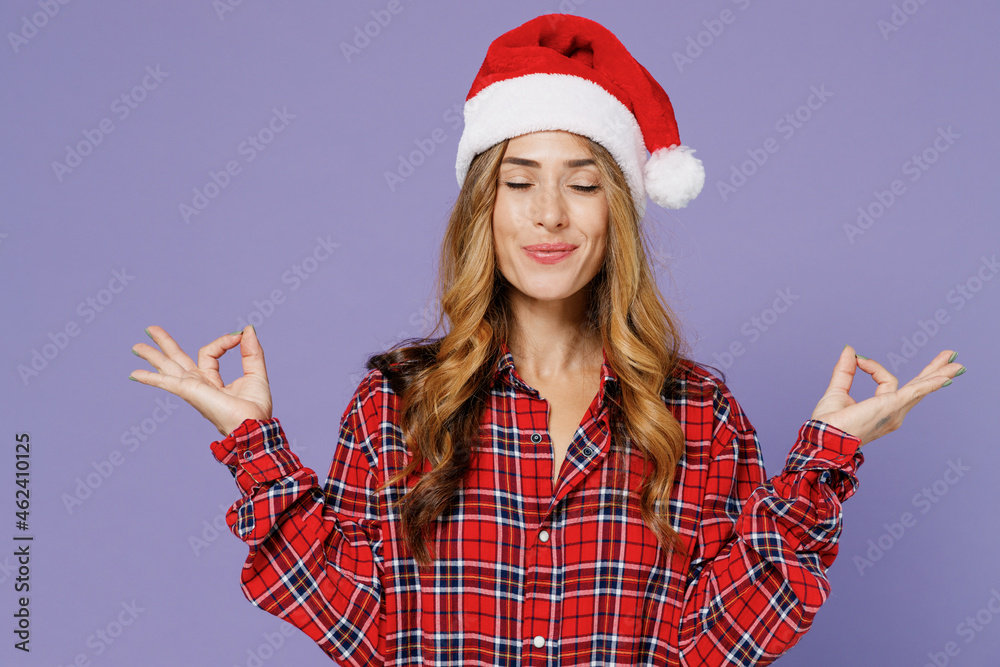 Spiritual tranquil young Santa woman 30s wears shirt Christmas hat hold ...