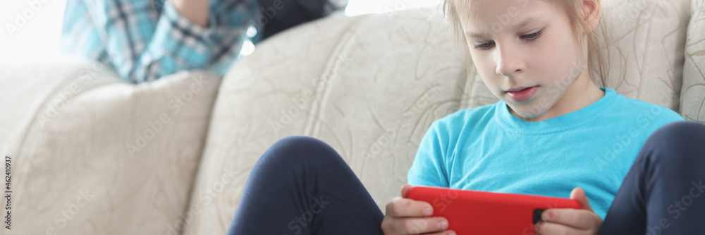 Mom controls her daughter with phone through binoculars Stock Photo ...